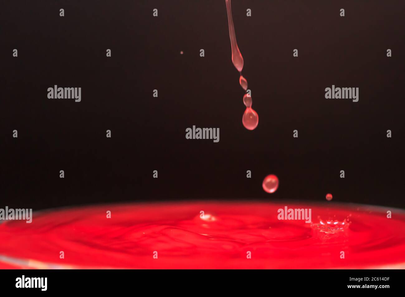 Color water drop falling, interesting forms made Stock Photo - Alamy