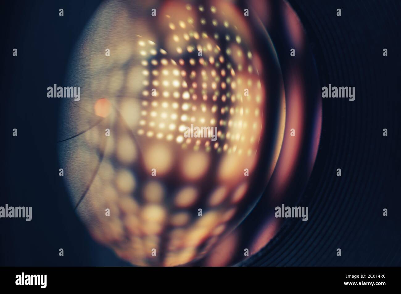 Beautiful Camera Lens on a dark with yellow shine reflection light ...