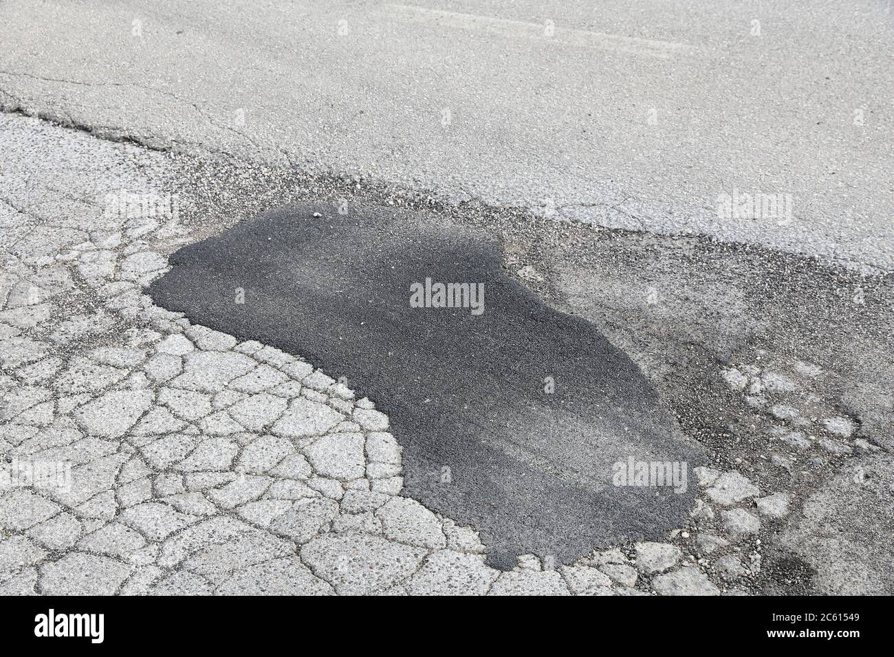 Road surface damage - bad maintenance quality. Asphalt cracks in Italy ...