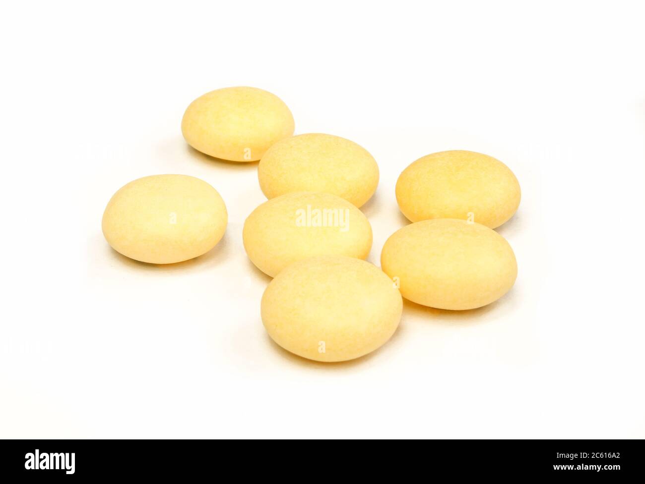 Group of yellow candies isolated on white background. Delicious fruity ...