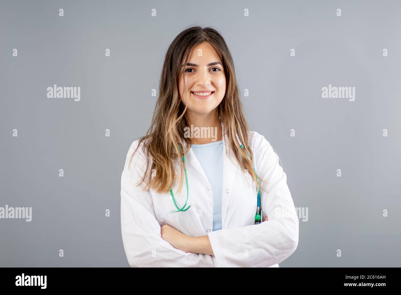Beautiful Turkish woman doctor with warm and confident smiling in a ...