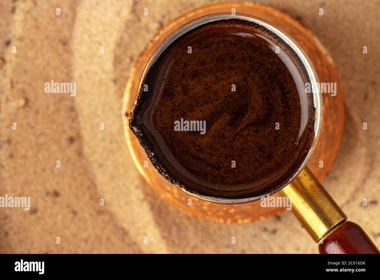 Process of preparation of coffee in turk in cezve on sand Stock Photo ...