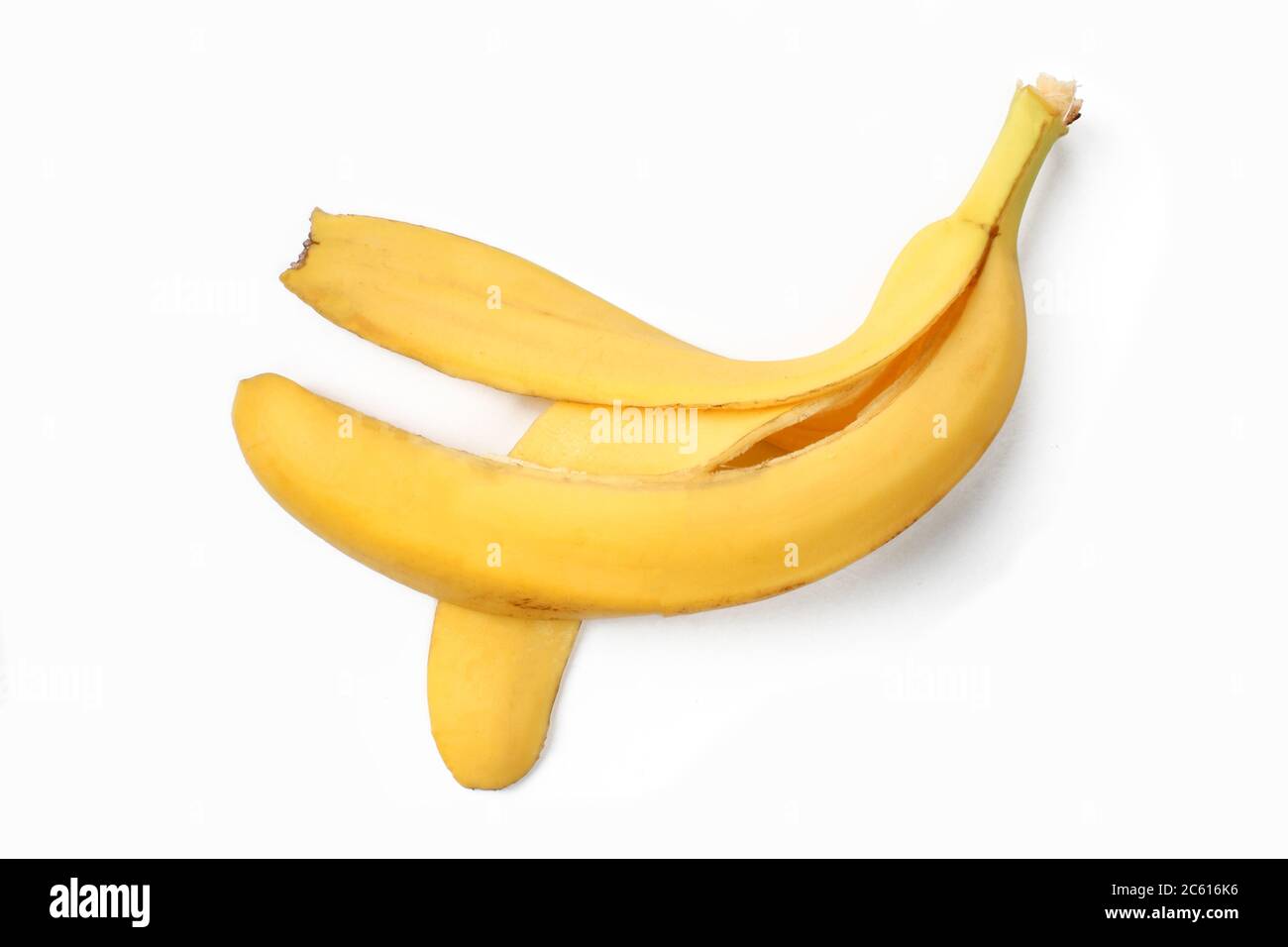 Yellow banana skin isolated on white background. Slippery eaten banana ...