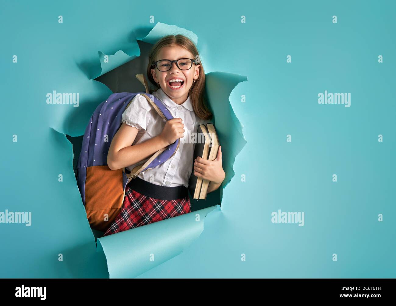 Back to school and happy time! Cute industrious child is breaking ...