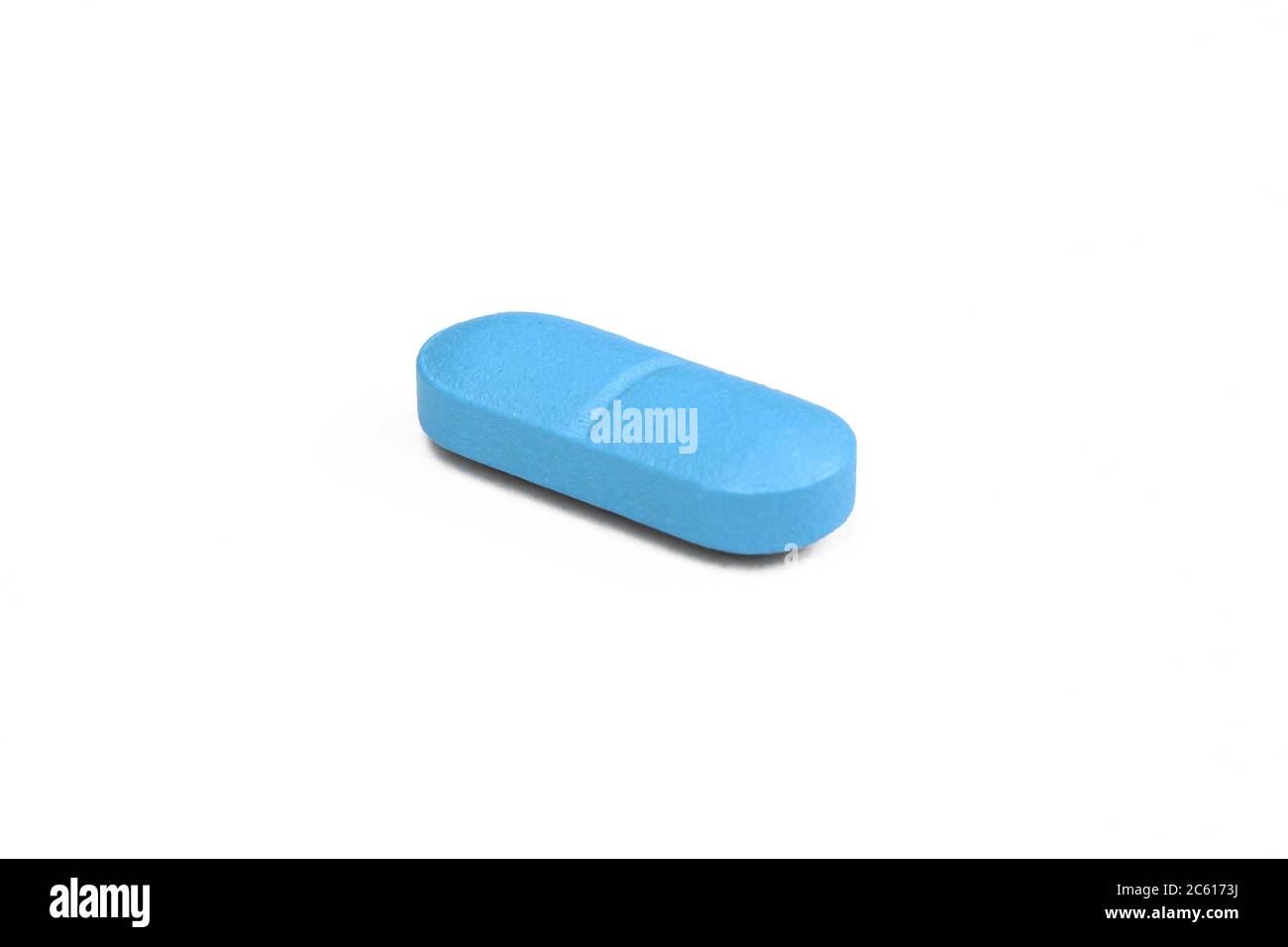 Single blue pill isolated on white background Stock Photo - Alamy