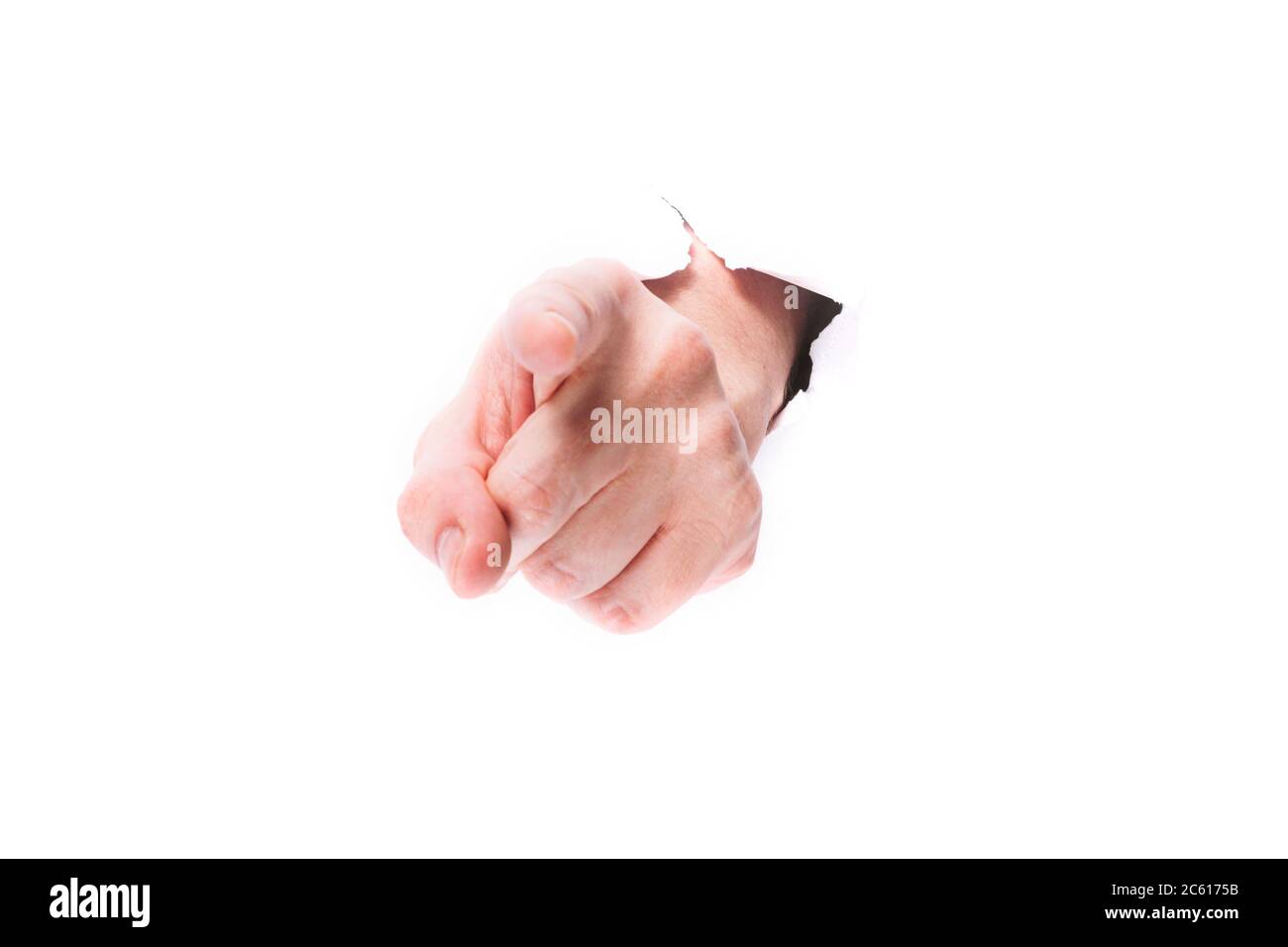male hand showing finger through a hole in paper on a white background ...