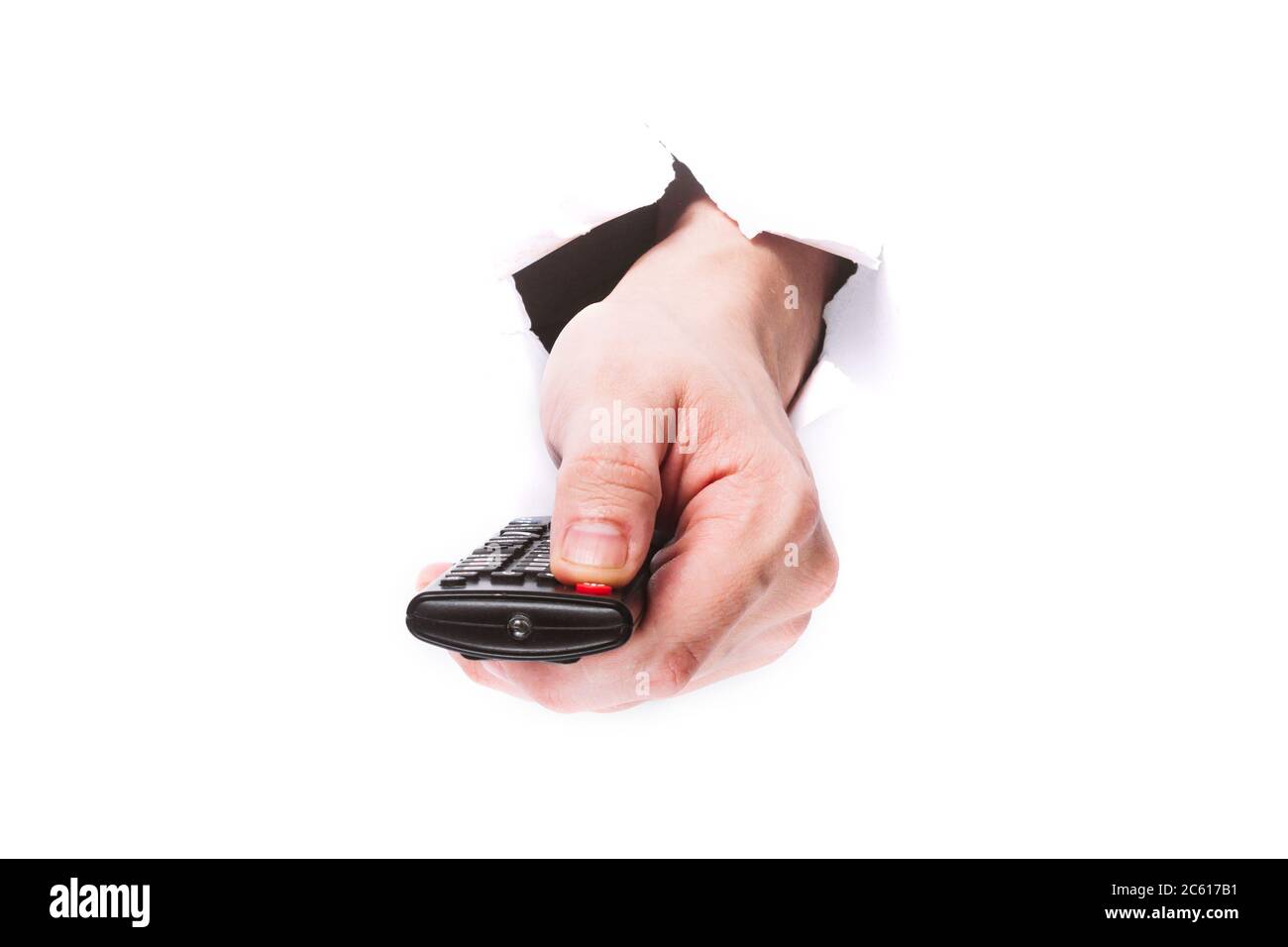 male hand with tv remote control presses the shutdown button through a ...