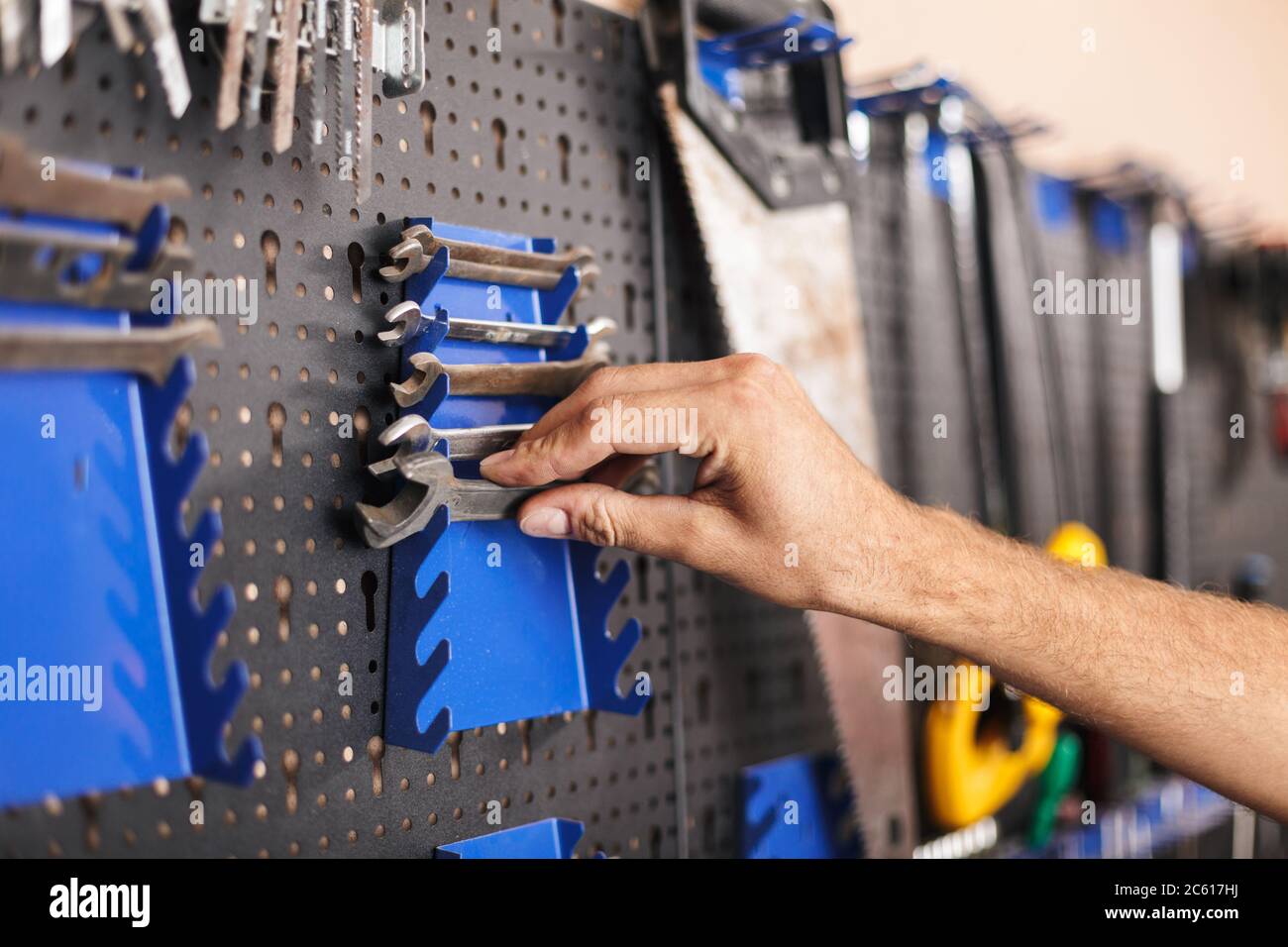 Hand with wrenches hi-res stock photography and images - Alamy
