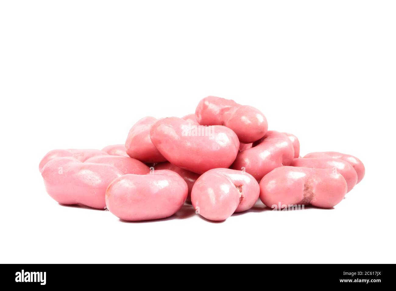 Peanut flips covered in pink strawberry flavor chocolate. Group of ...