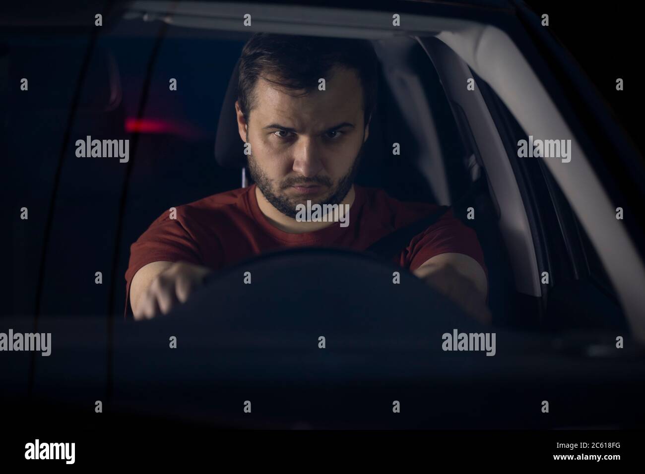 sad depressed man spending time alone at car at night feeling ...