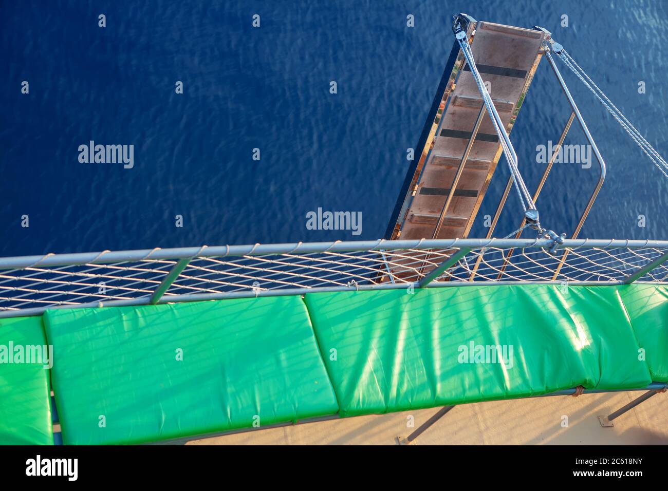 Wooden ship ladder . Blue sea background . Touristic ship with sun ...