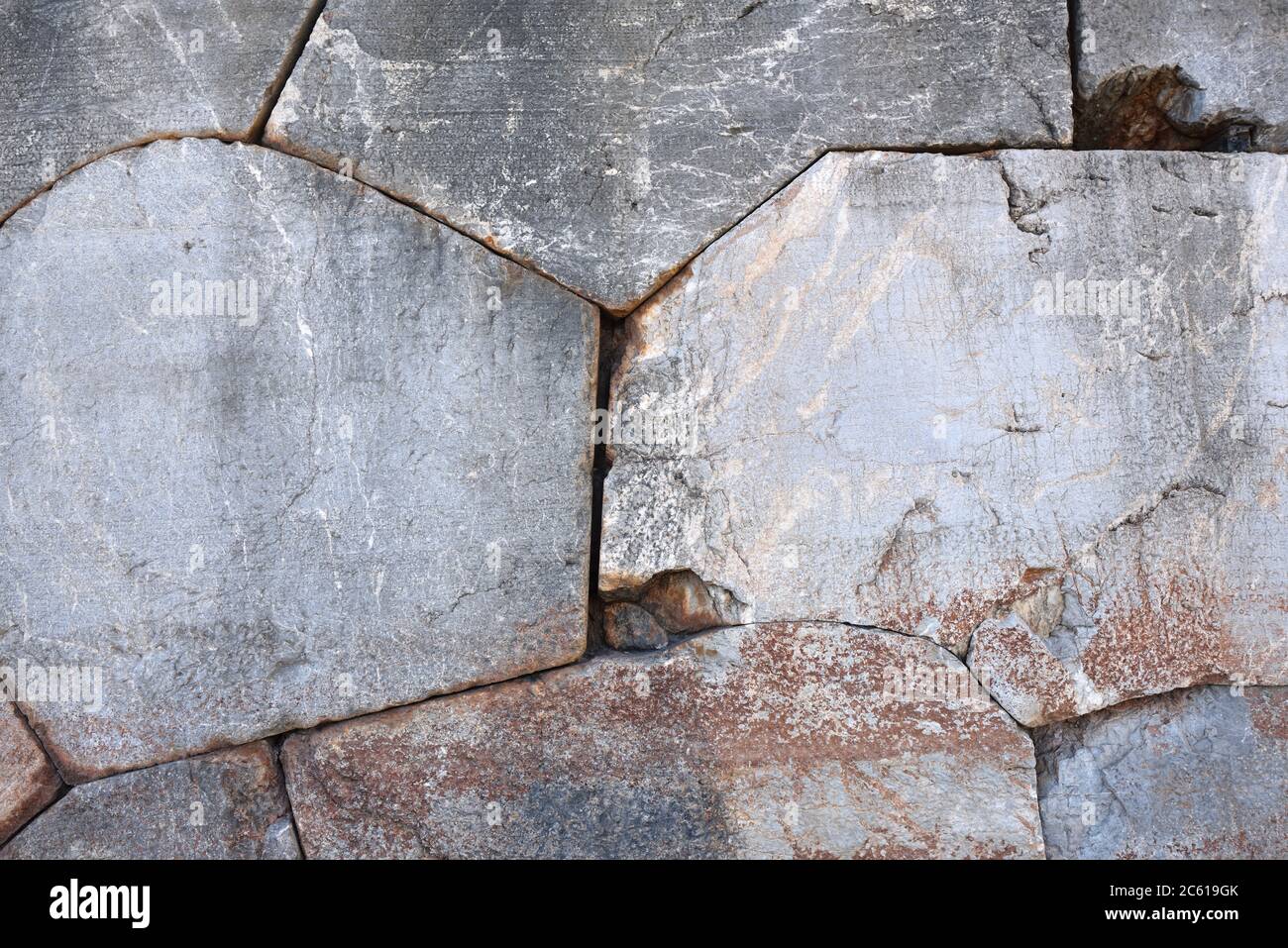 Detail of stone wall with engraved letters. The temple Apollo Temple in ...