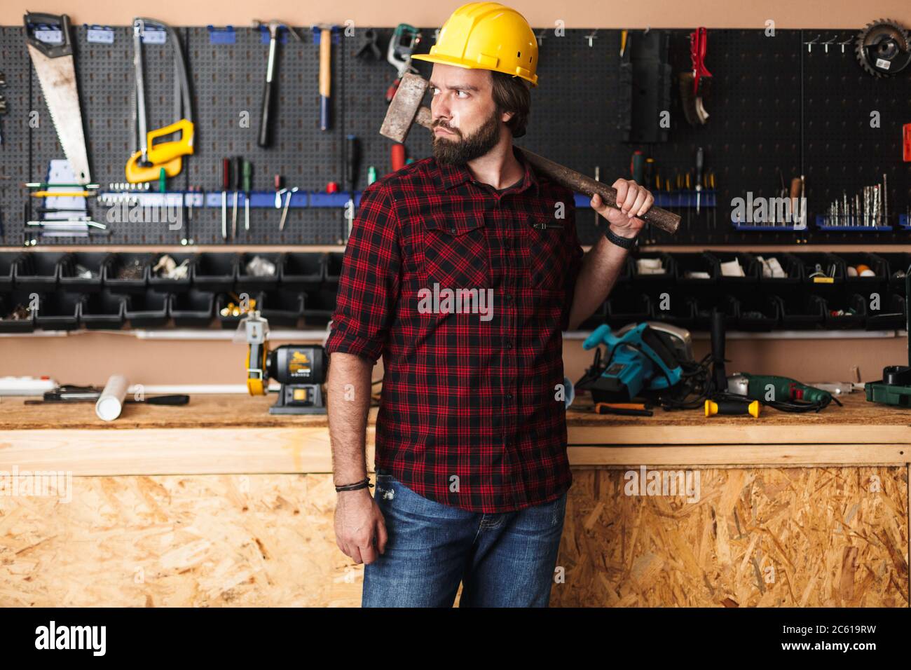 Man Holding Hammer On His Shoulder High Resolution Stock Photography ...