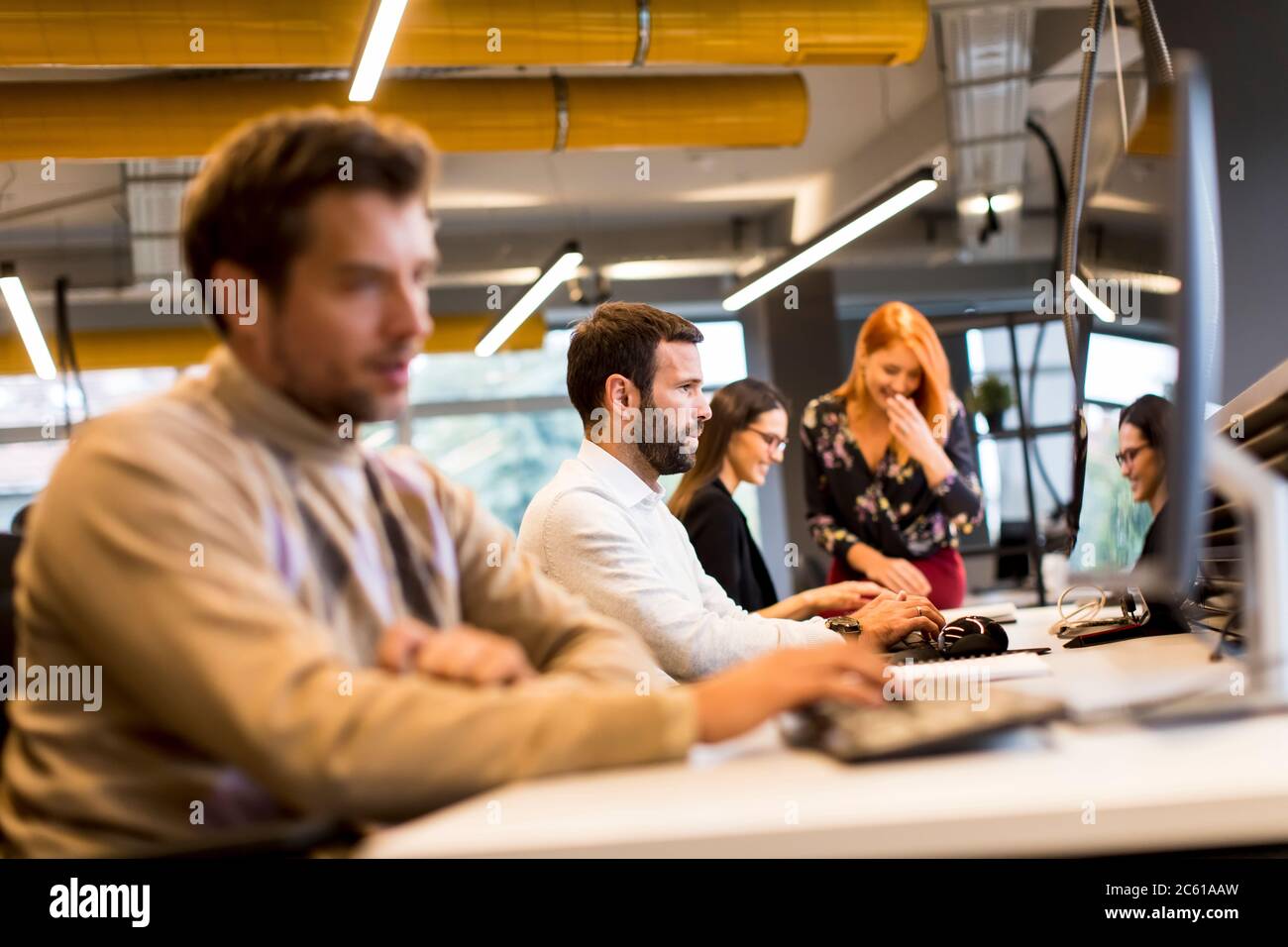 Handsome young professional businessman uses a computer for work in the ...