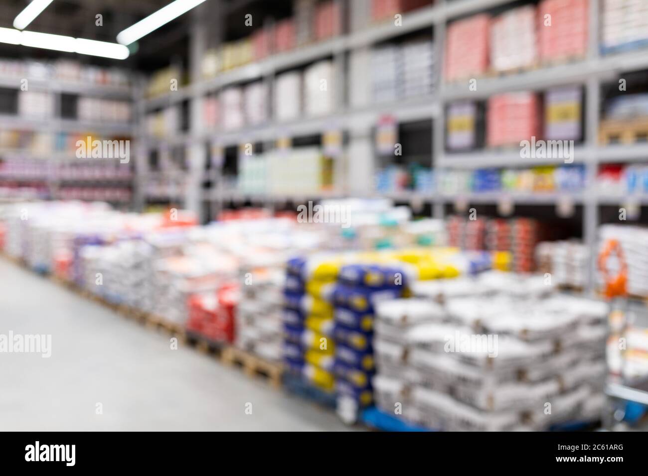 blurred background of a hardware store with bags of cement Stock Photo ...