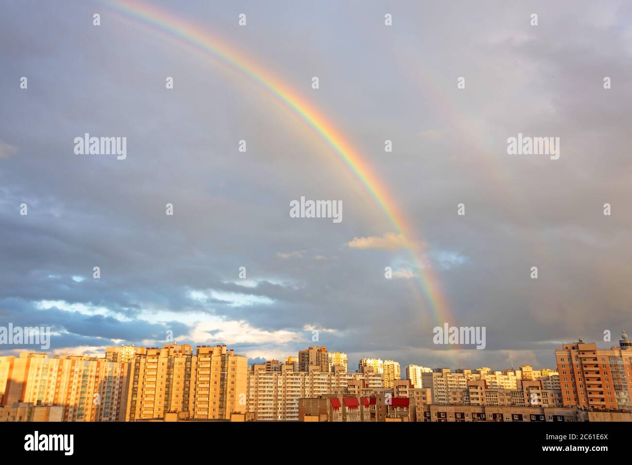 Bright colorful rainbow over, sun shining in rainy day, beautiful ...