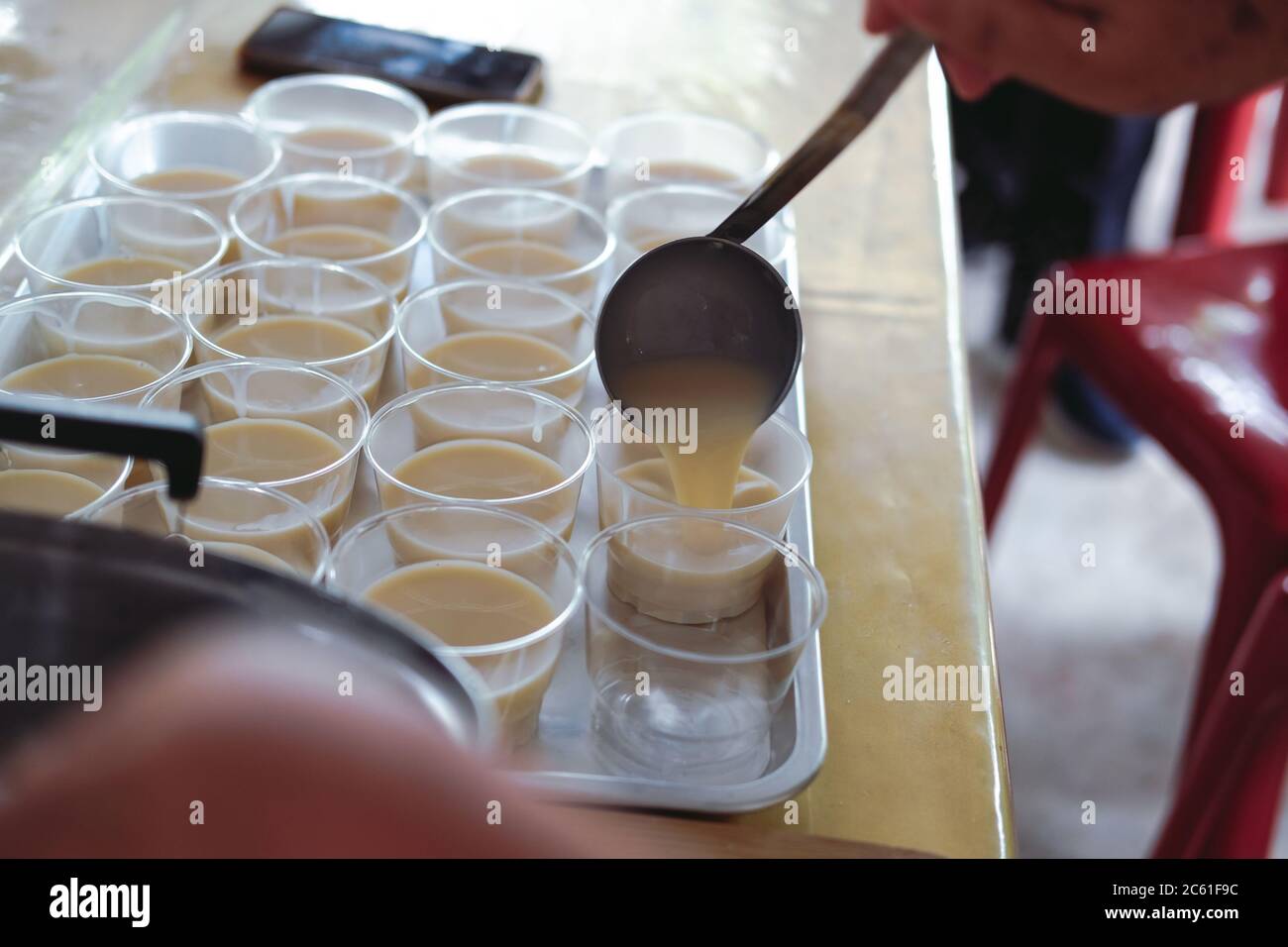 soy milk pudding in plastic cup. vegan dessert for vegetarian Stock ...