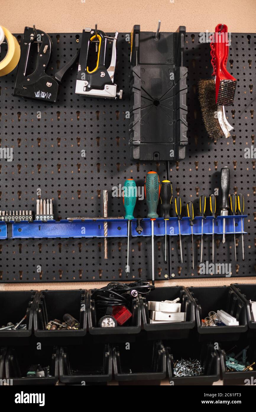 Close up stand with variety of modern tools in workshop isolated Stock ...