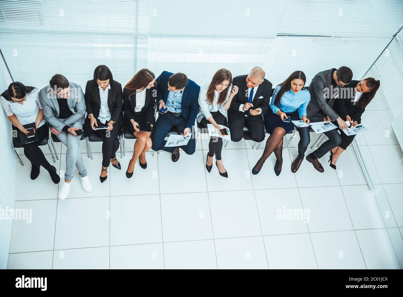 top view. Manager discussing business schedules with company employees ...