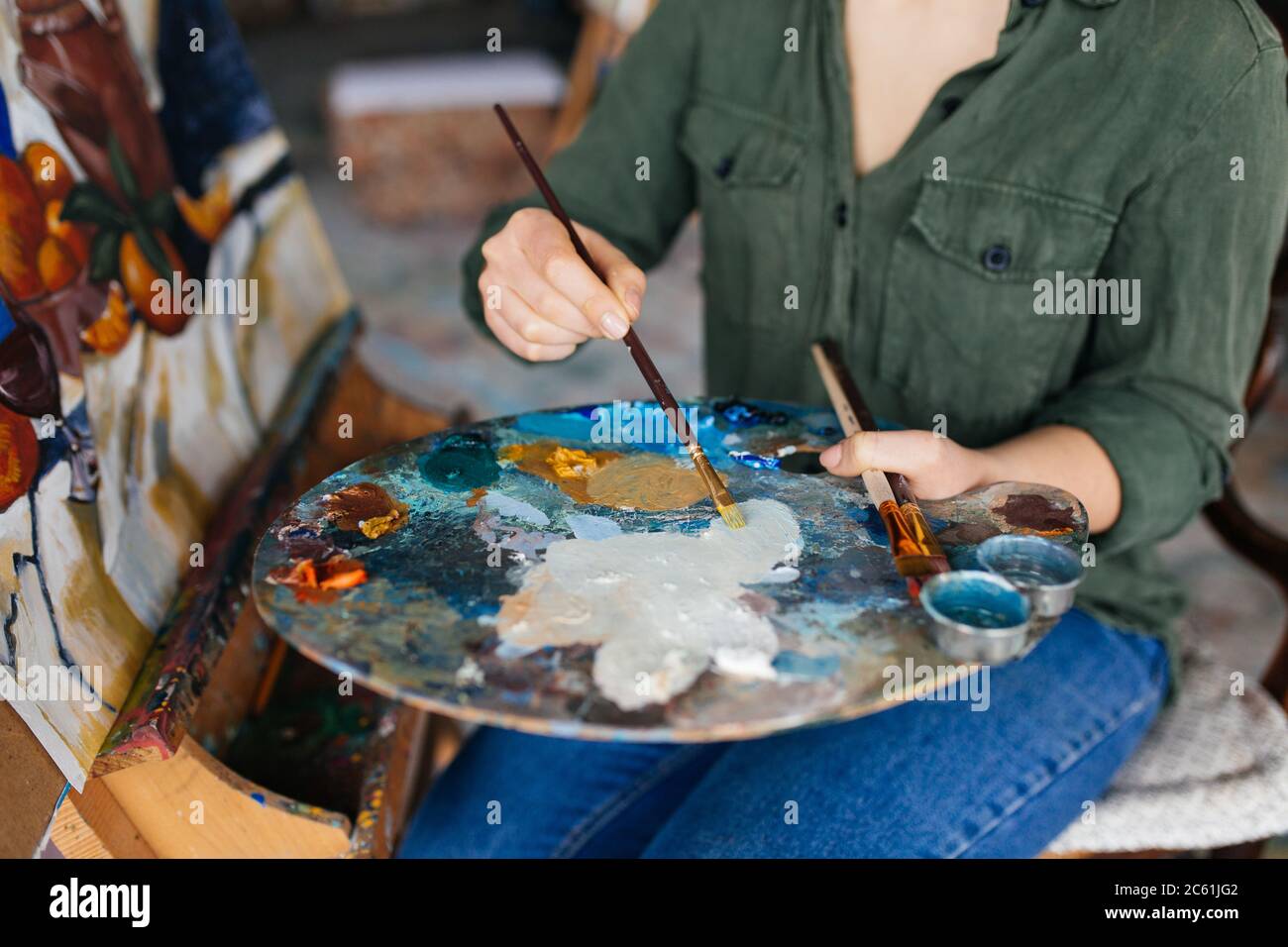 Close up beautiful woman hands holding paint brush drawing amazing ...