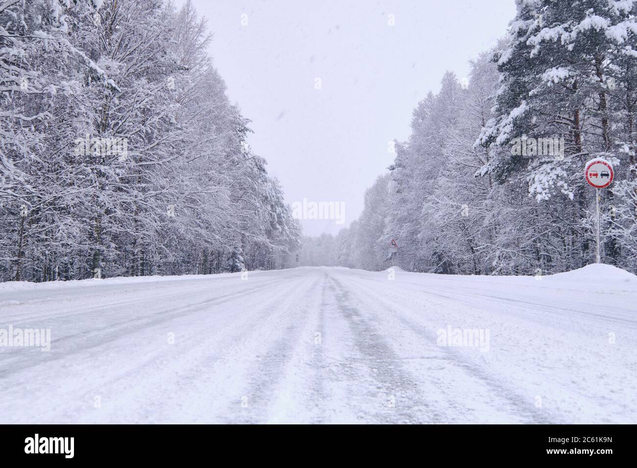 Countryside road covered white clear snow. Snow covered forest Stock ...