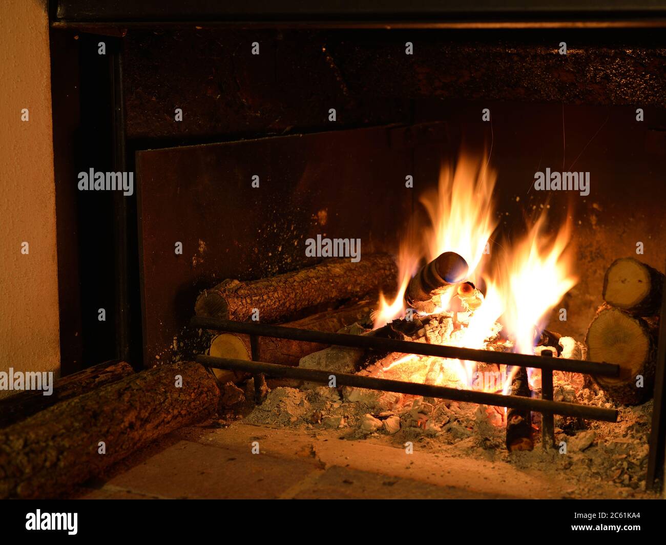 Fireplace with wood and fire closeup Stock Photo - Alamy