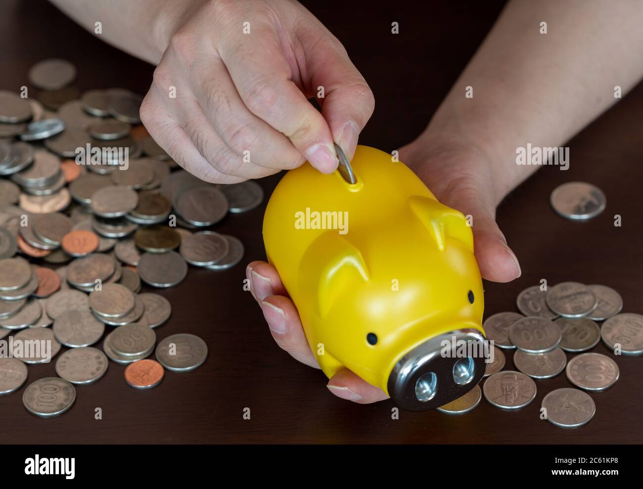 Business mans hand putting coins hi-res stock photography and images ...