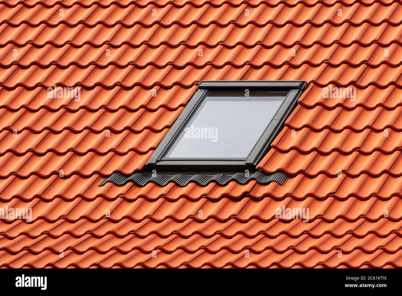 Modern Roof Skylight Window on Red House Clay Ceramic Tiles Roof ...