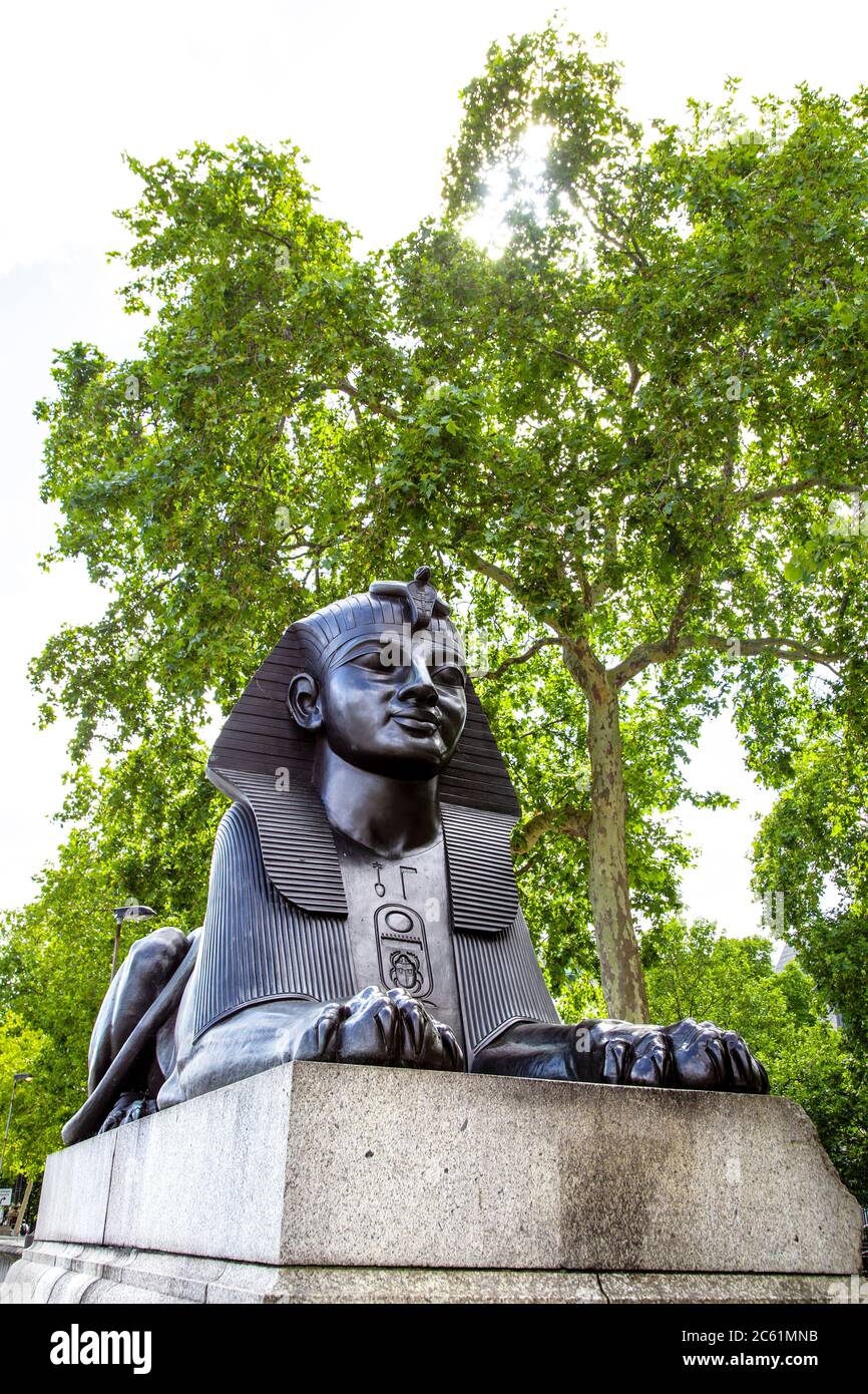 Egyptian-style sphinx on the side of Cleopatra's Needle obelisk on ...