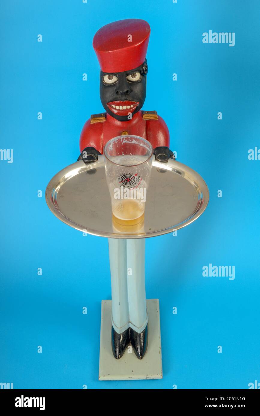 Statue of a black servant with a glass of beer on a tray Stock Photo ...