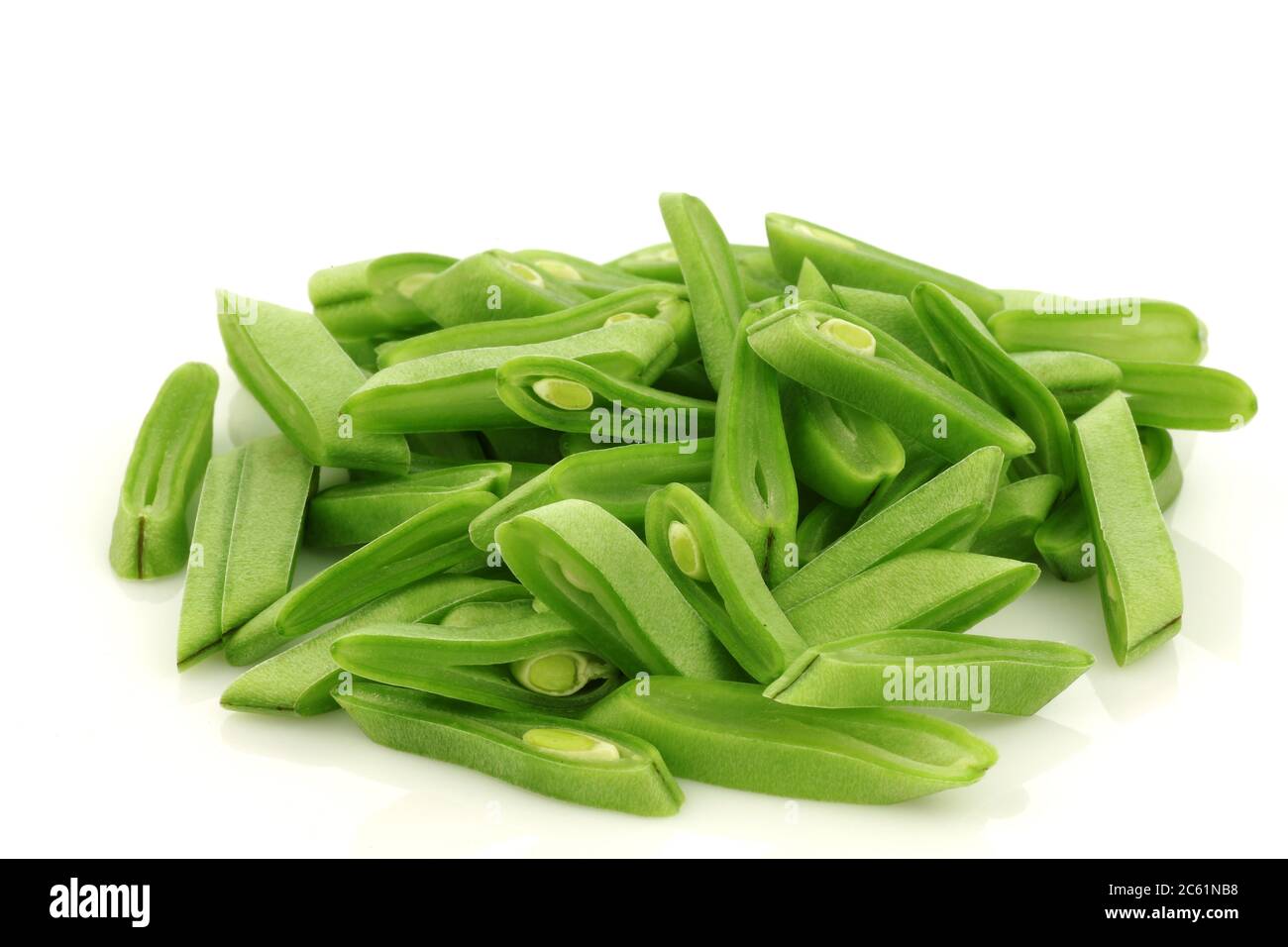 bunch of cut string beans on a white background Stock Photo - Alamy