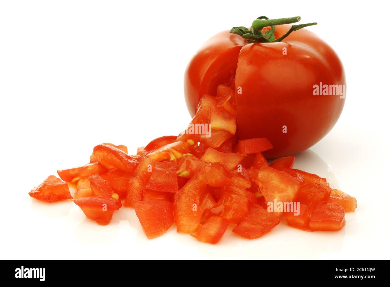 fresh tomato with front side opened and already cut pieces coming out ...