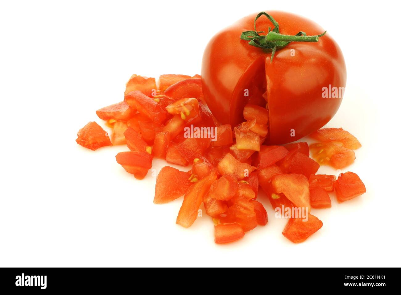fresh tomato with front side opened and already cut pieces coming out ...