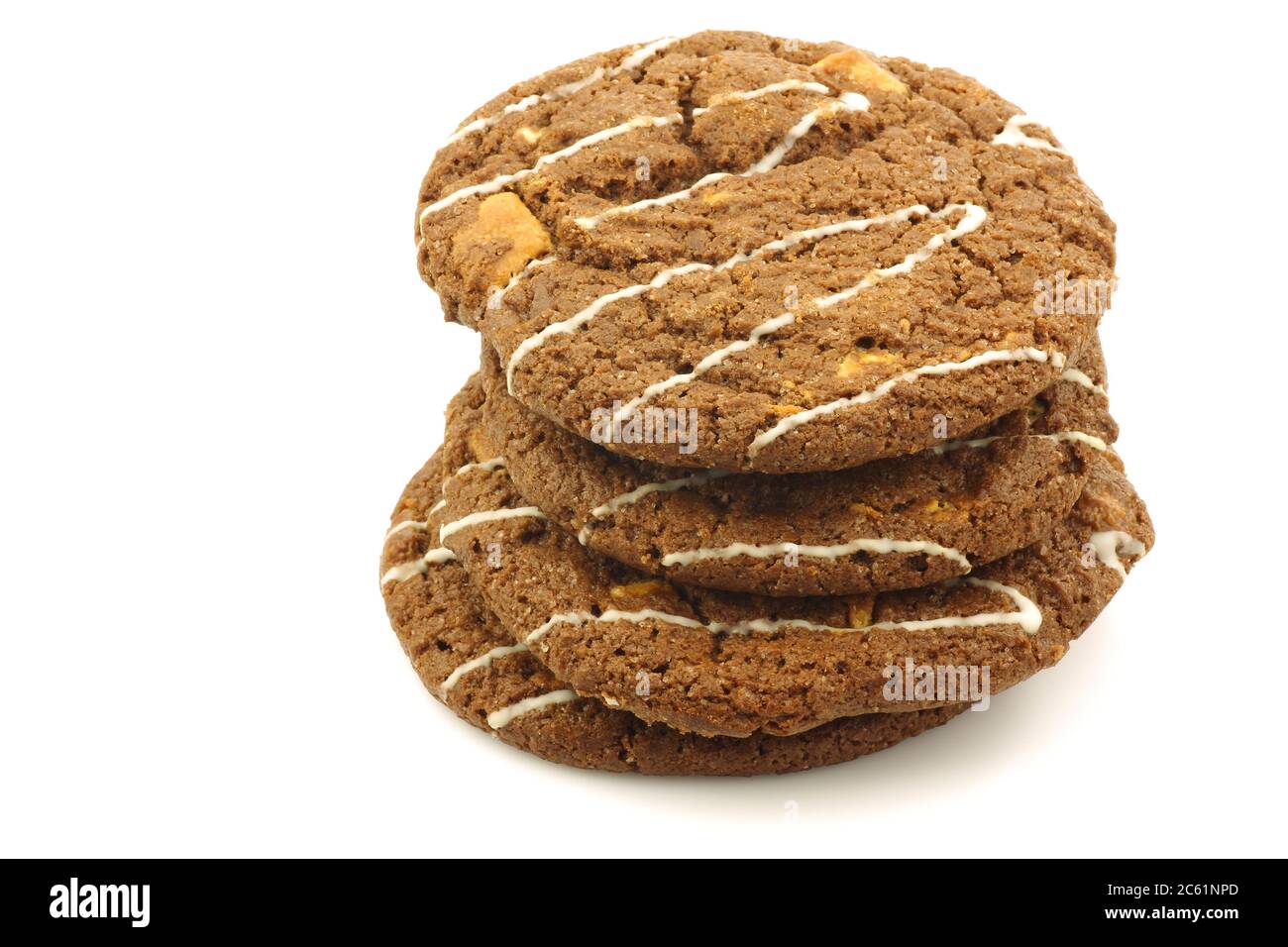 Crunchy chocolate chip cookies with nuts decorated with white chocolate ...