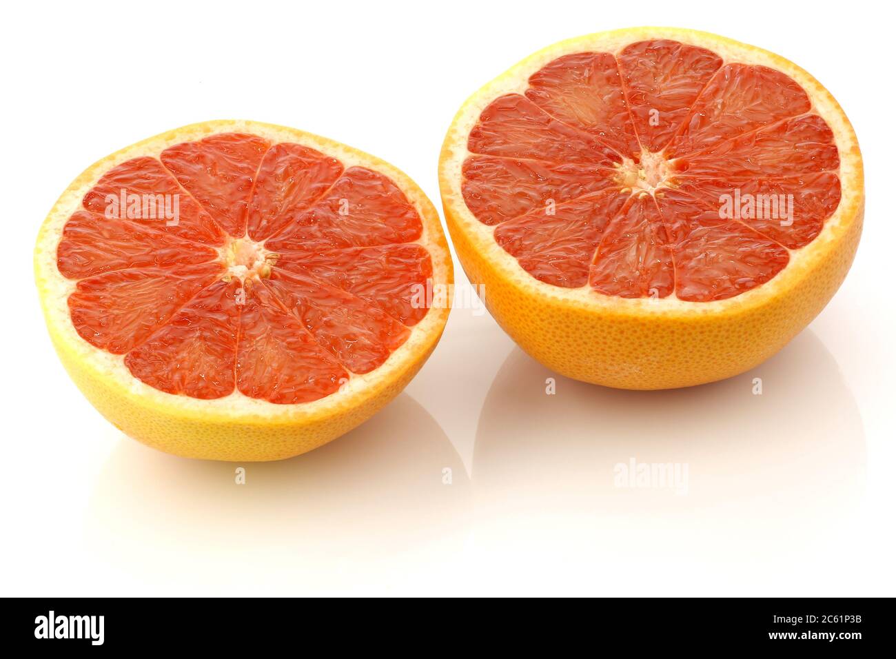two fresh red grapefruit halves on a white background Stock Photo - Alamy
