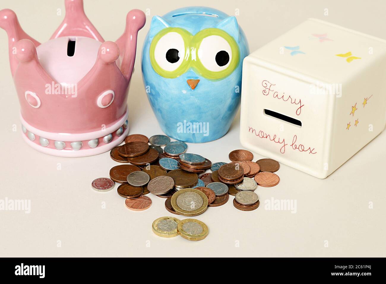 Five piggy pennies hi-res stock photography and images - Alamy