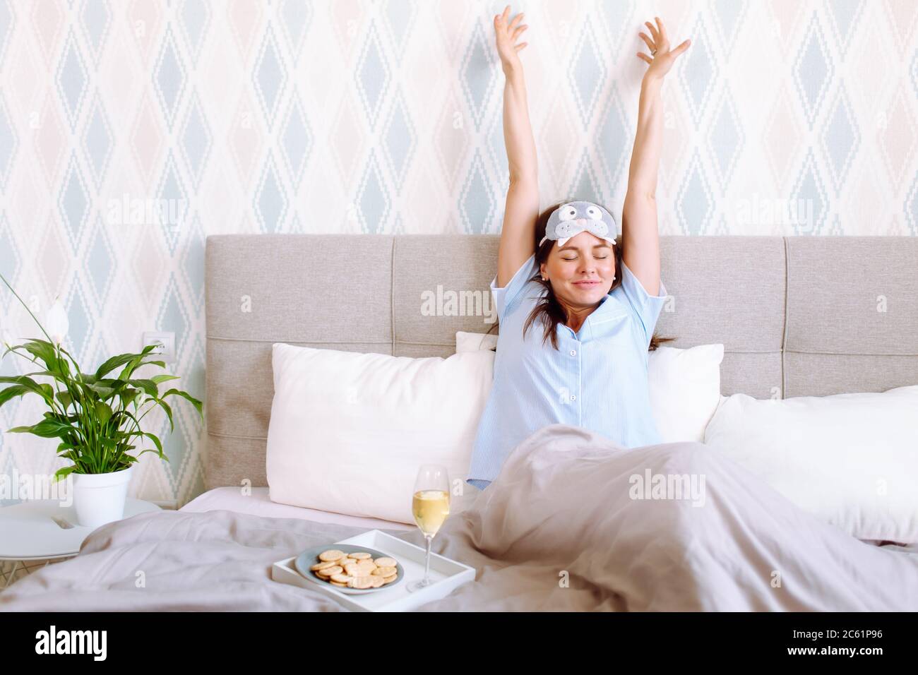 Young woman waking up happily, after a good night sleep Stock Photo - Alamy