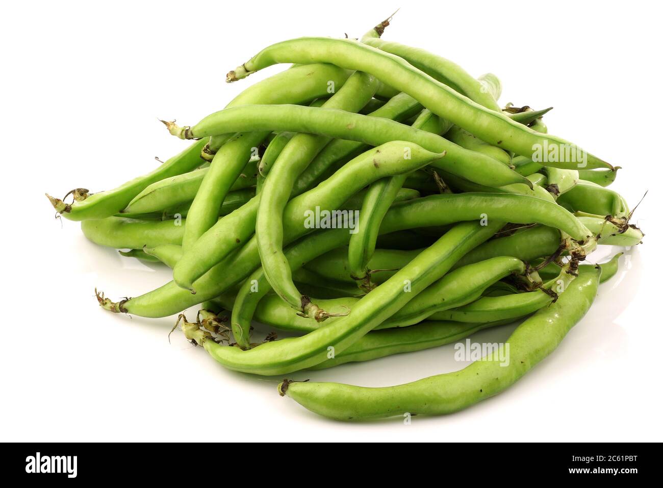 bunch of broad beans on a white background Stock Photo - Alamy