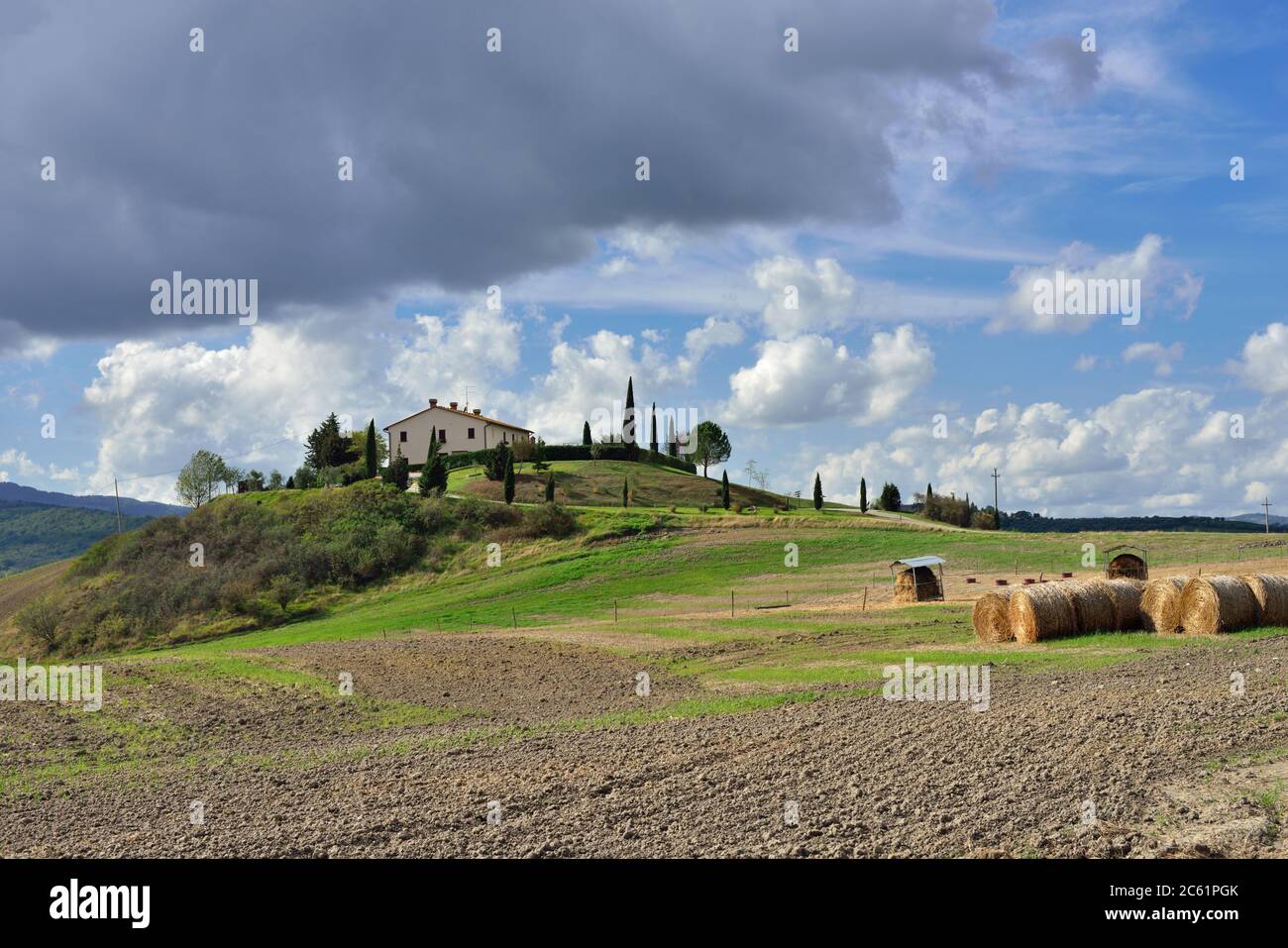 Rural landscape with farmhouse, plow and stack of hay. Tuscan, Italy ...