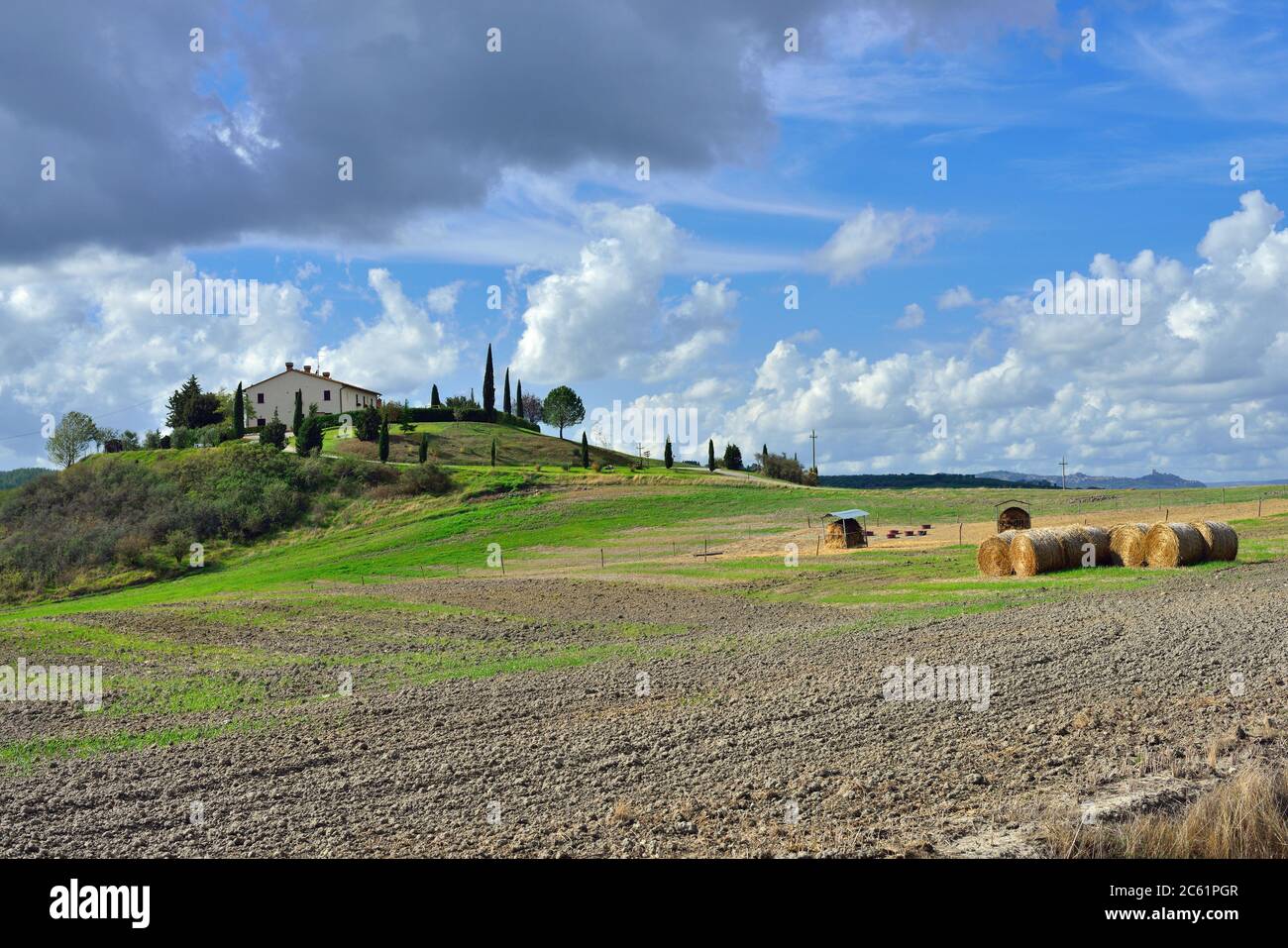 Rural landscape with farmhouse, plow and stack of hay. Tuscan, Italy ...