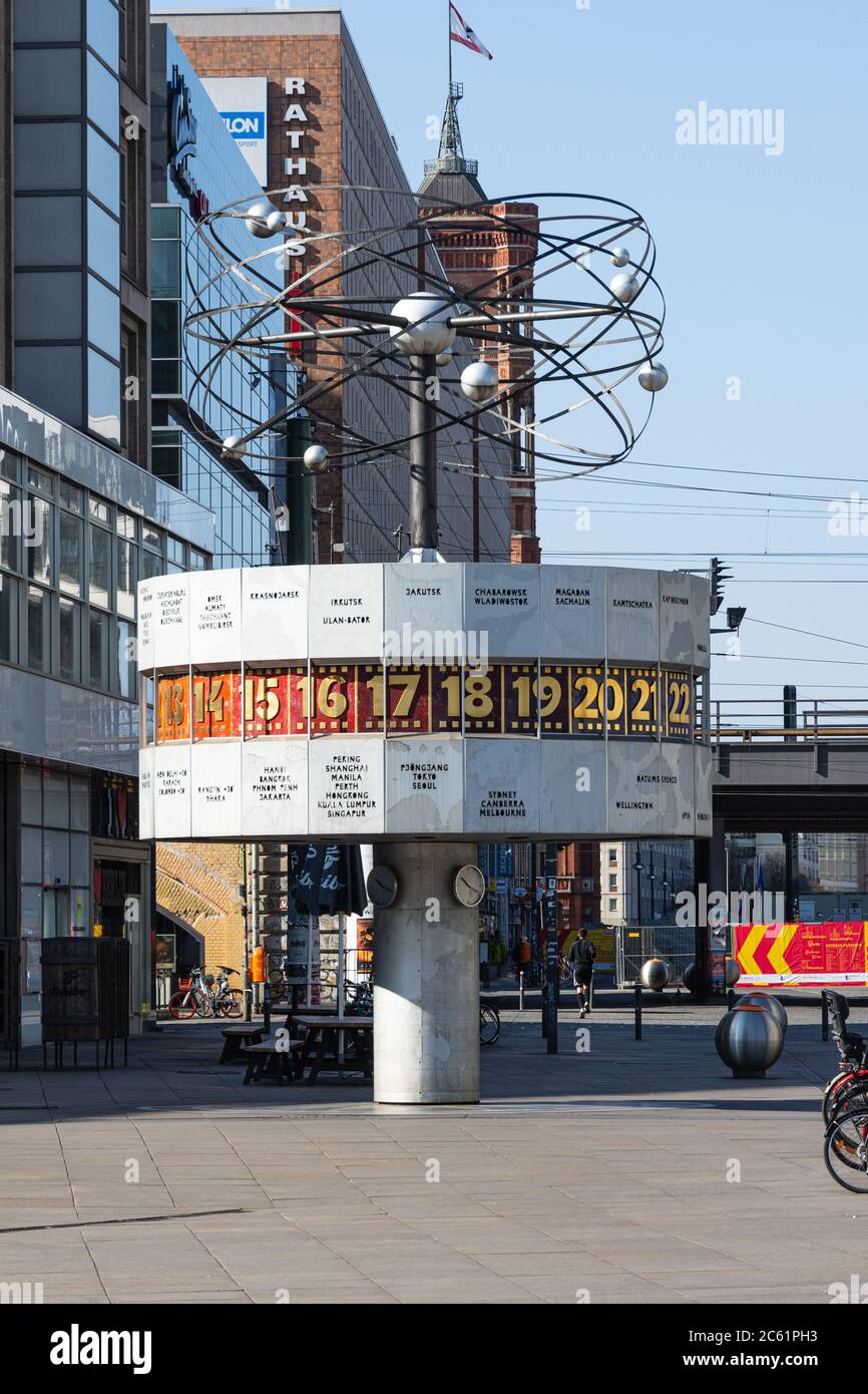 World clock in Berlin at Alexanderplatz with the Berlin city train in ...