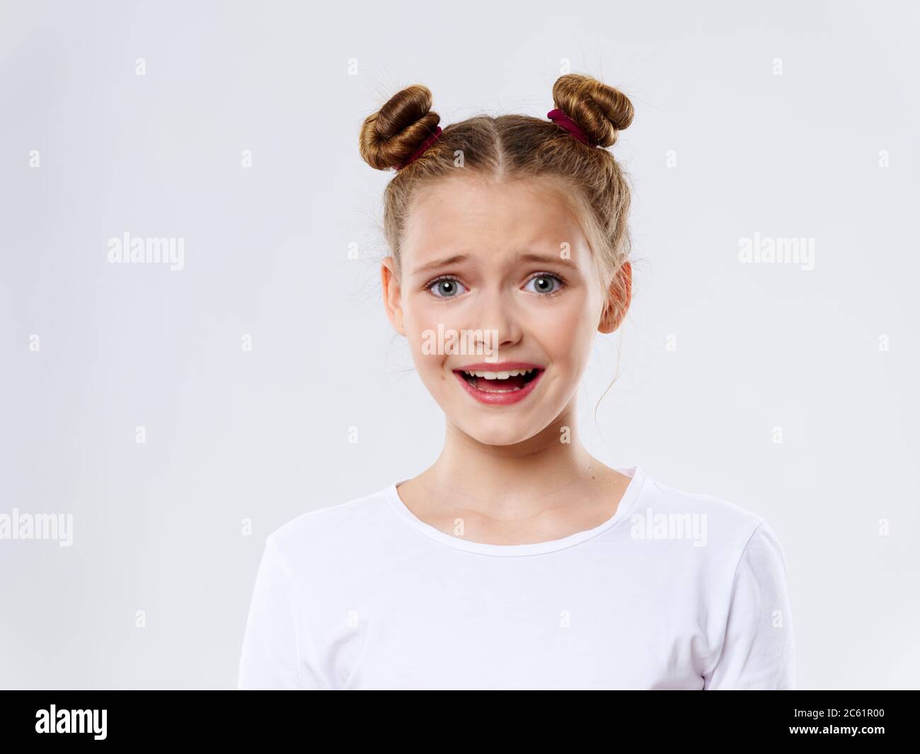 Cheerful pretty girl pigtails emotions confused look Stock Photo - Alamy