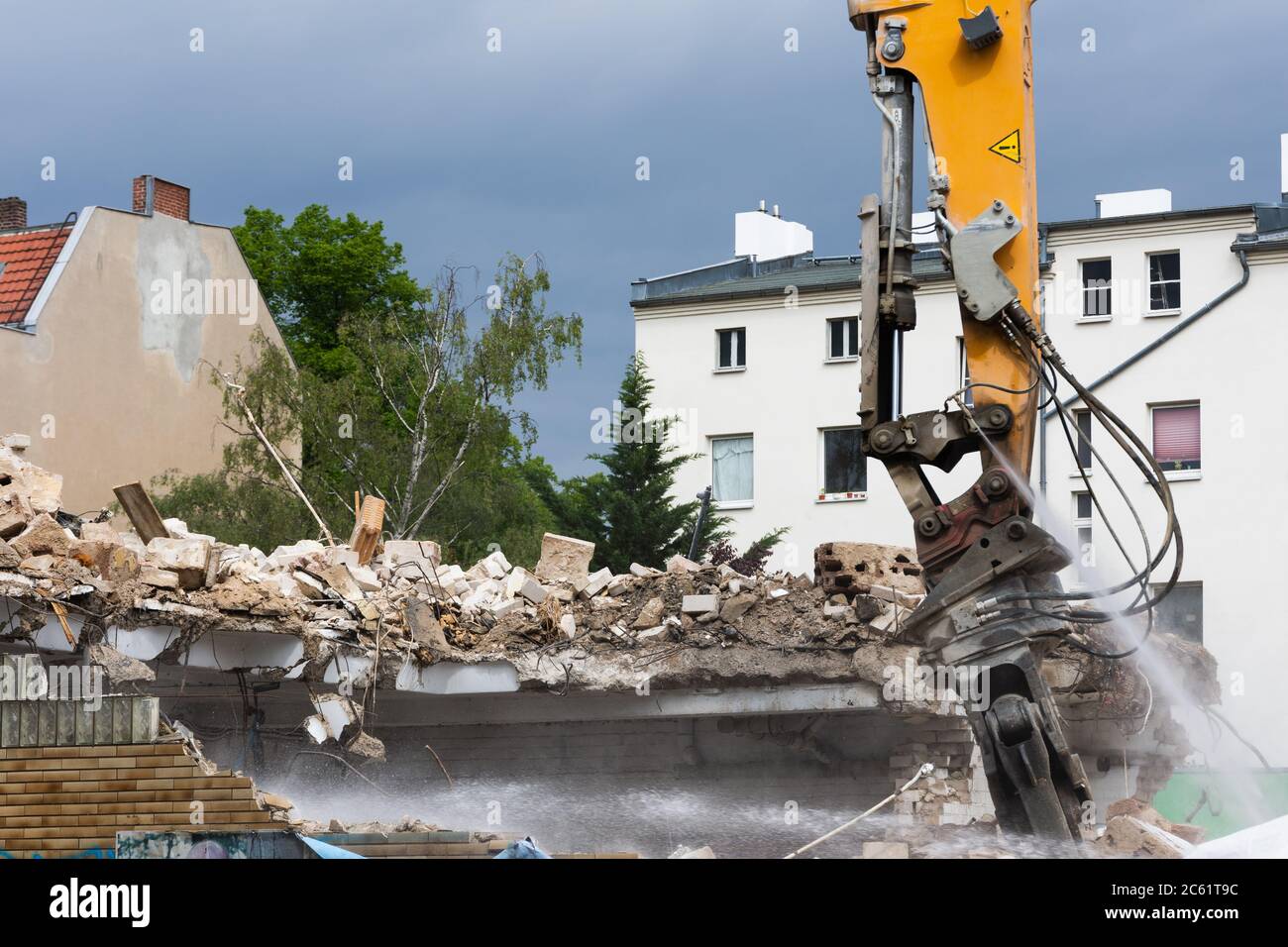 Demolition excavator at work Stock Photo - Alamy