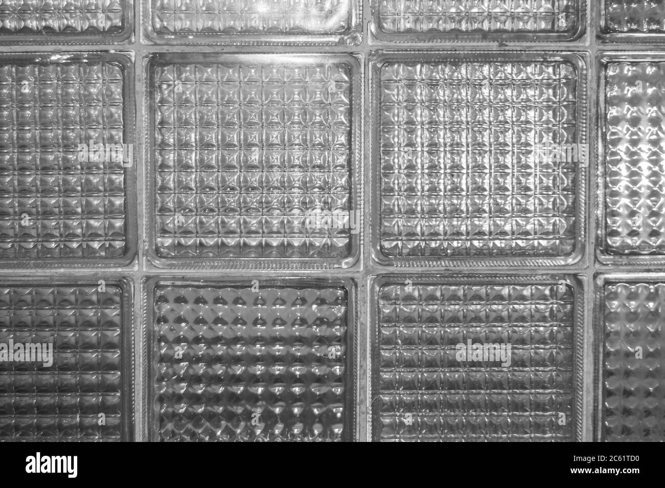Glass transparent square tile wall background, black and white photo ...