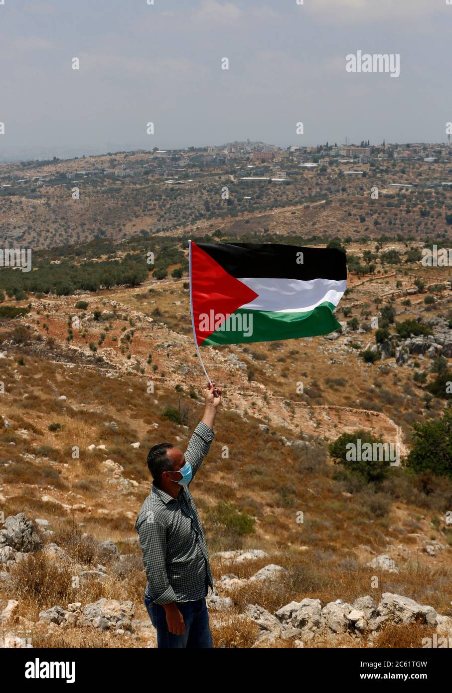 Salfit. 6th July, 2020. A Palestinian takes part in a protest against ...