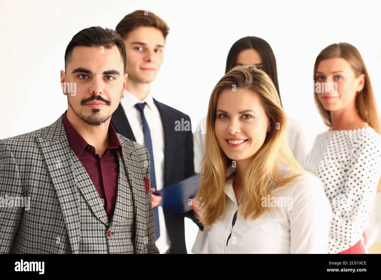 Successful happy workers are posing at camera Stock Photo - Alamy