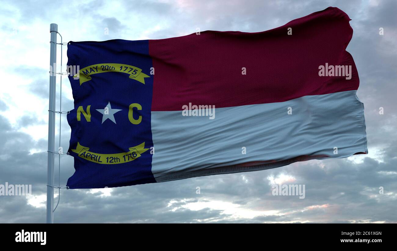 Flag of North Carolina waving in the wind against deep beautiful clouds ...