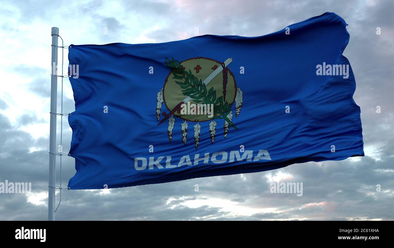 Flag of Oklahoma waving in the wind against deep beautiful clouds sky ...