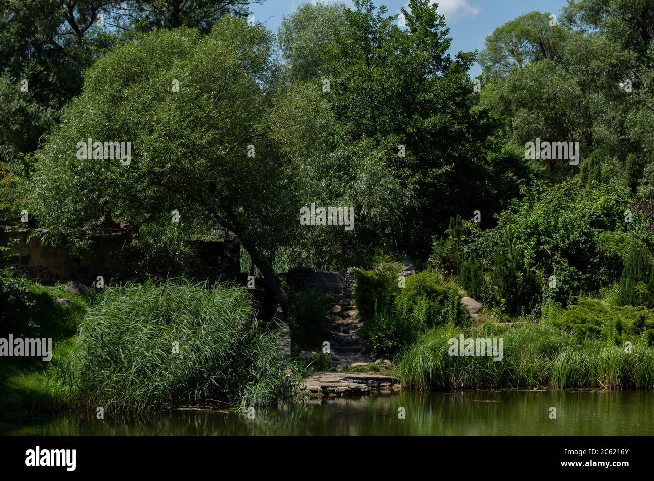 a large beautiful lake with green landscape Stock Photo - Alamy