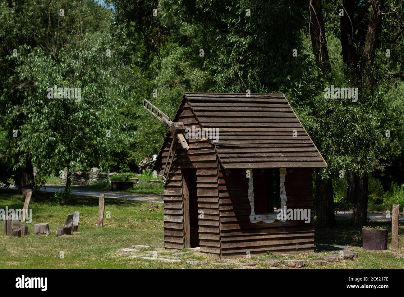 small wooden house with mill Stock Photo - Alamy